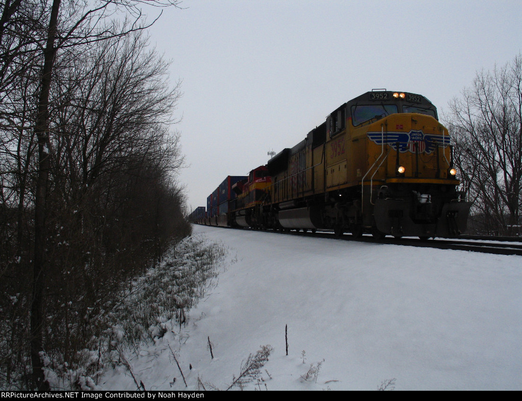 UP 3952 and KCS 4108 pull Q132 though the snow